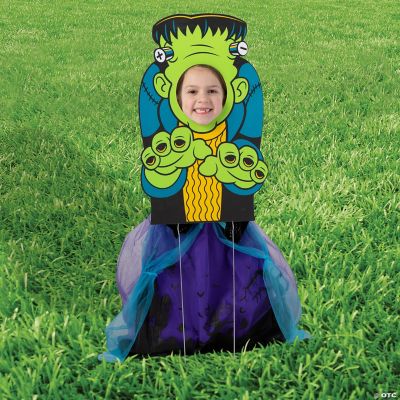 15" x 24" Green Monster Face Yard Sign | Oriental Trading